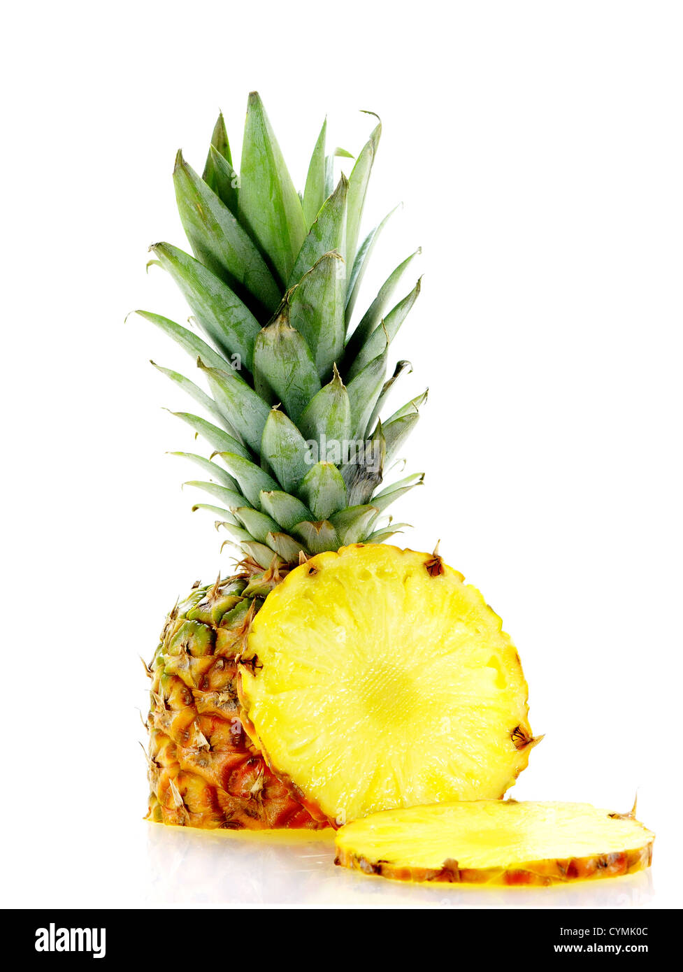 fresh ripe pineapple with slices over white background Stock Photo - Alamy