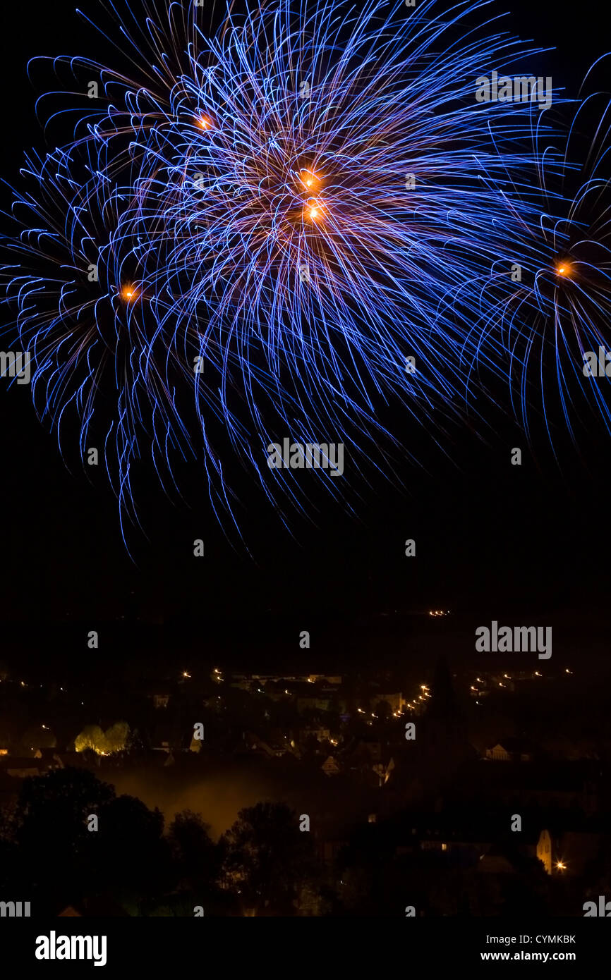 Fireworks by night over a town Stock Photo - Alamy