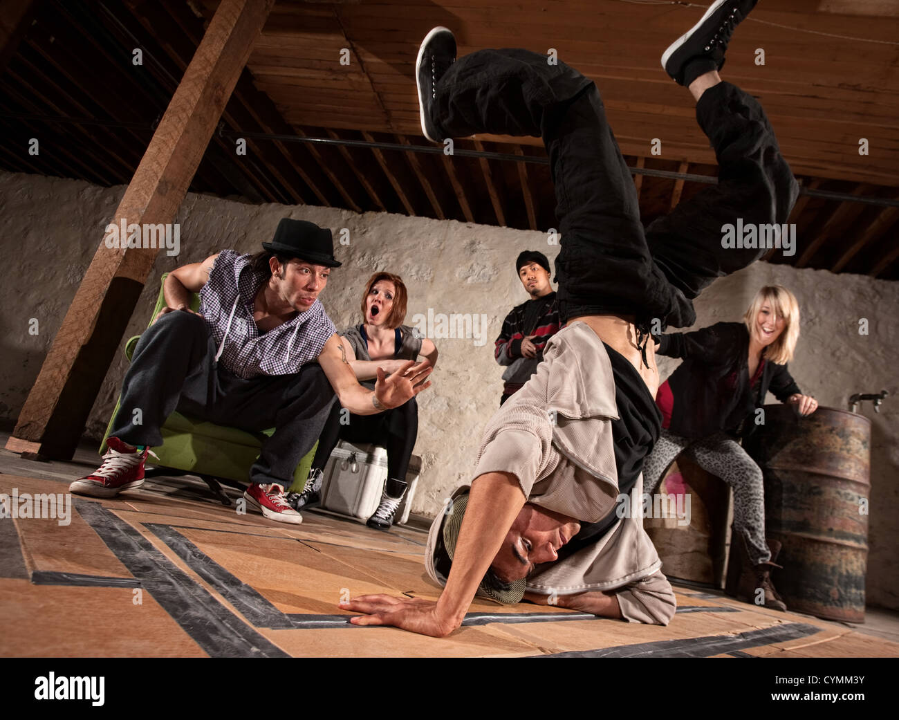 Young man showing friends freestyle moves on cardboard Stock Photo - Alamy