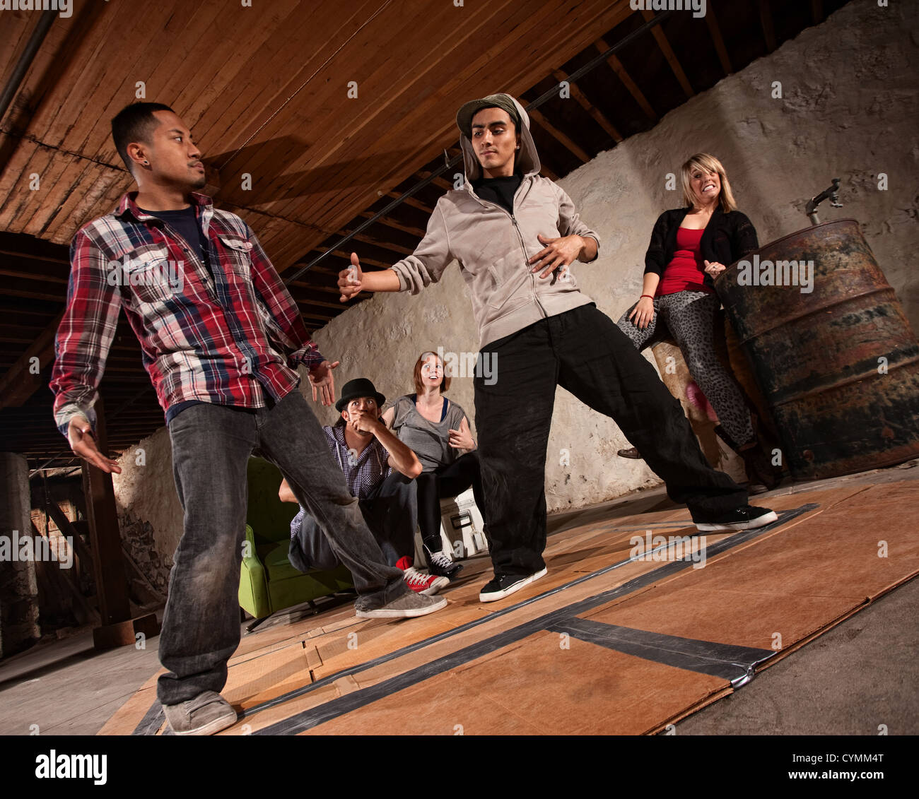 Two handsome Latino men face off in break dancing battle Stock Photo ...