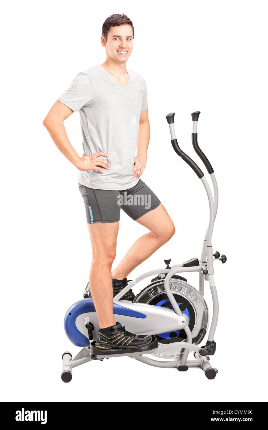 Full length portrait of an athlete standing on a cross trainer machine ...