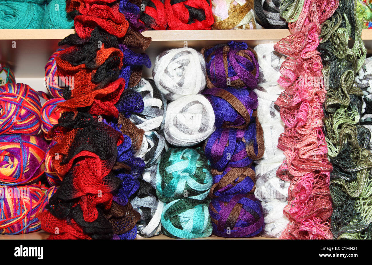 Colourful balls of wool on shelves Stock Photo - Alamy