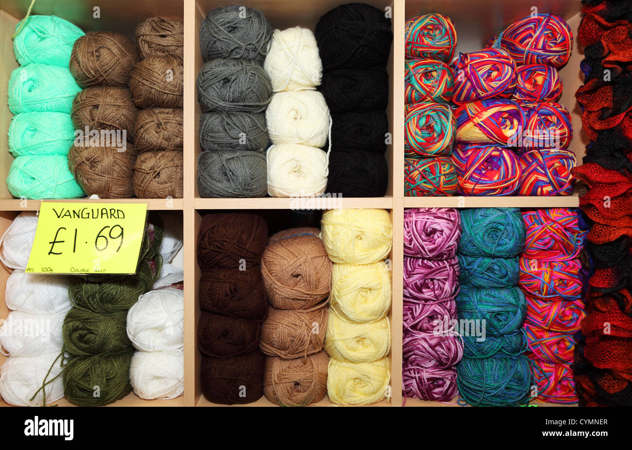 Colourful balls of wool on shelves Stock Photo - Alamy