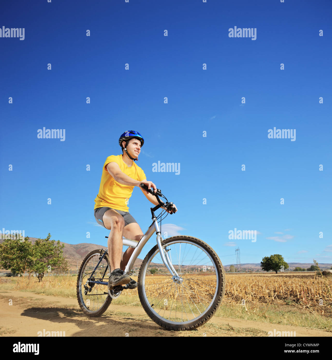 View of a biker riding a mountain bike outdoor Stock Photo - Alamy