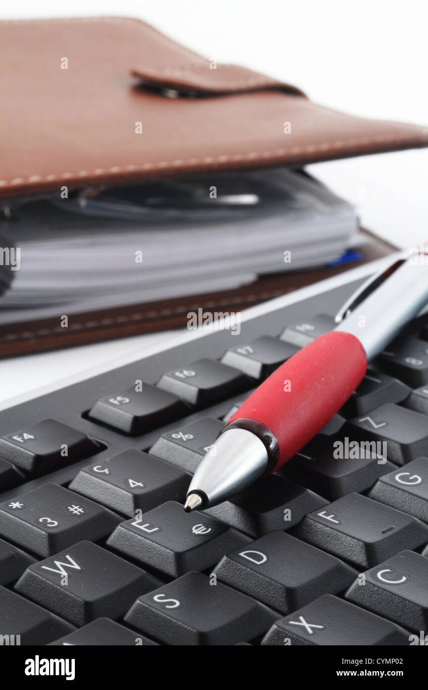 computer keyboard and organizer with pan in business office Stock Photo ...