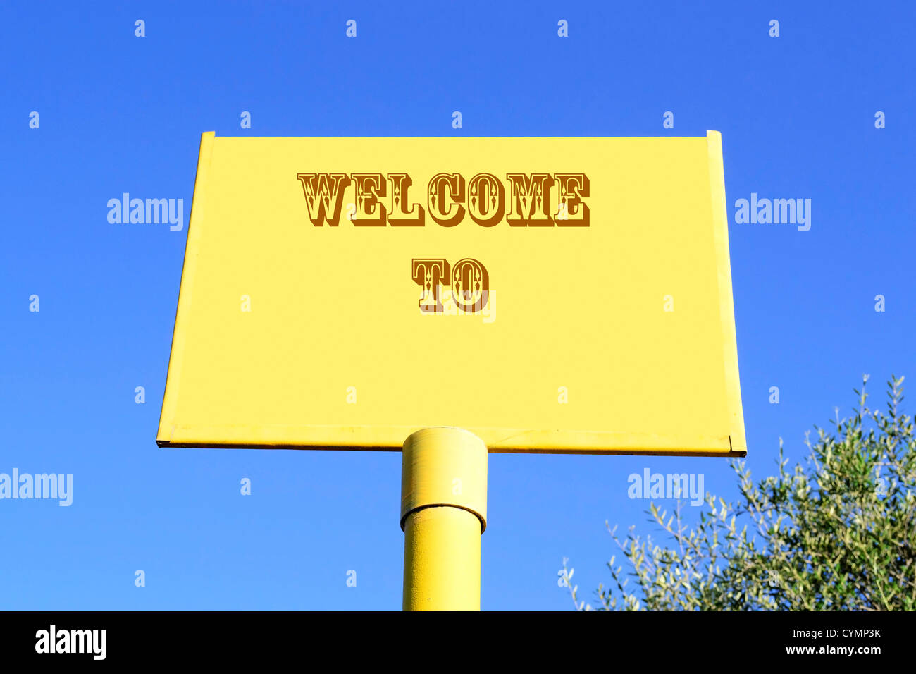 welcome to writing on a yellow sign under a clear blue sky Stock Photo ...
