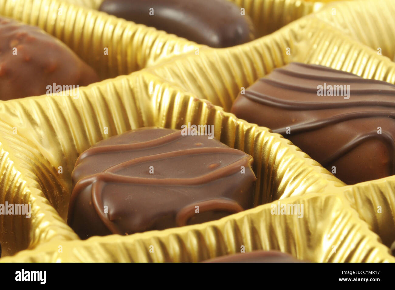 golden praline gift box with chocolate candys Stock Photo - Alamy