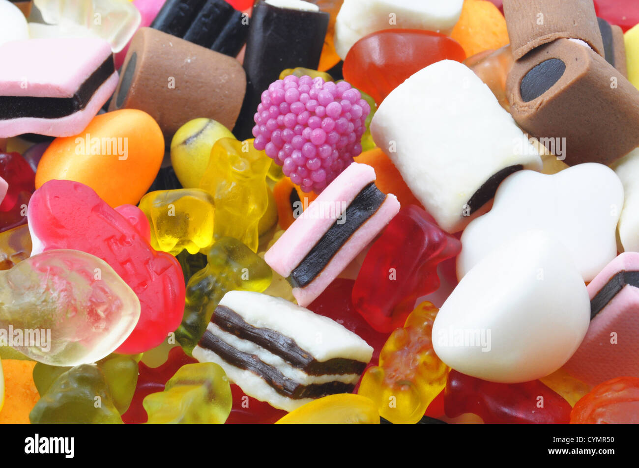 unhealthy candy background or texture in vibrant colors Stock Photo - Alamy
