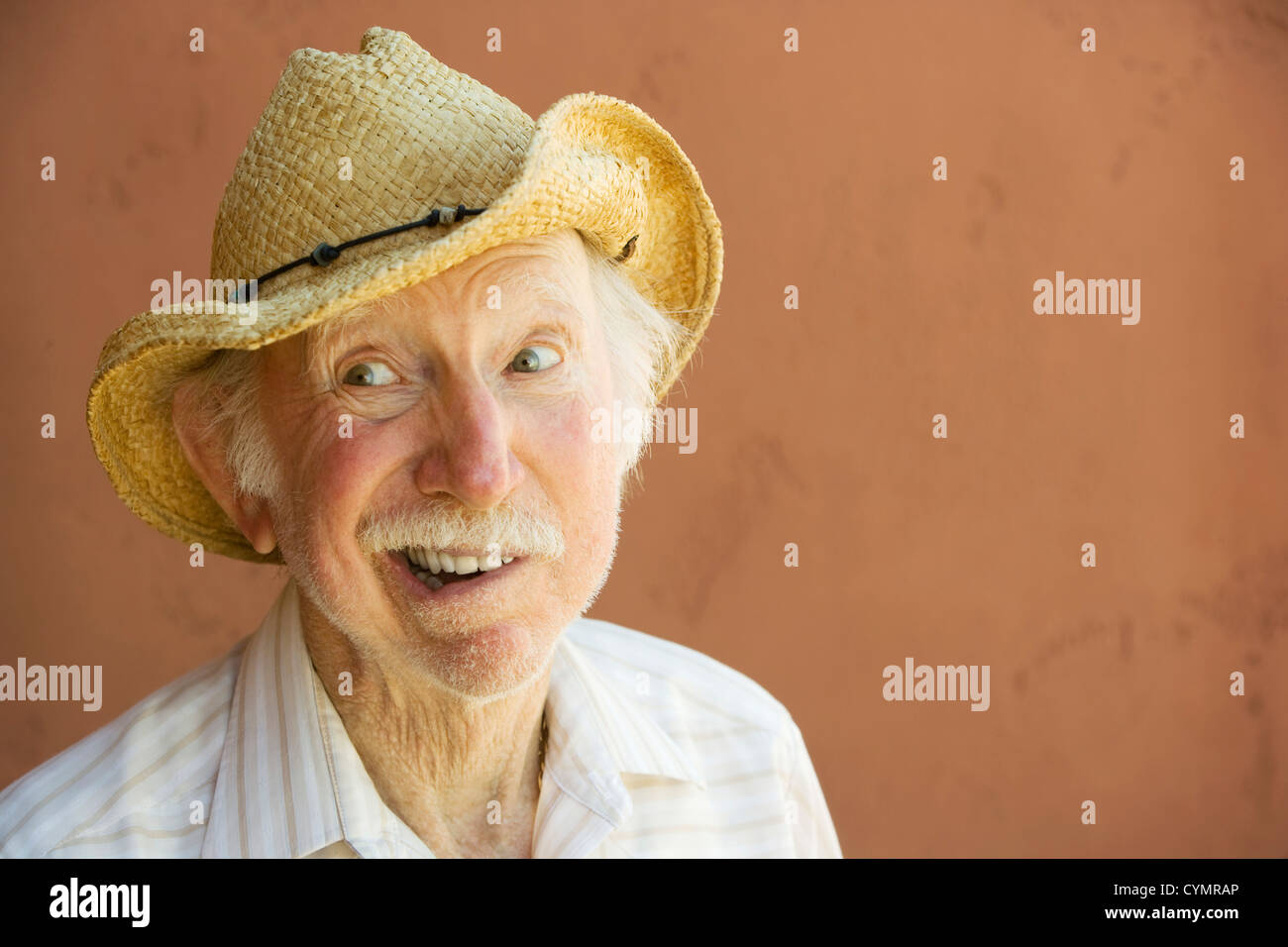 Senior Citizen Man Smiling in a Straw Cowboy Hat With Copy Space Stock ...