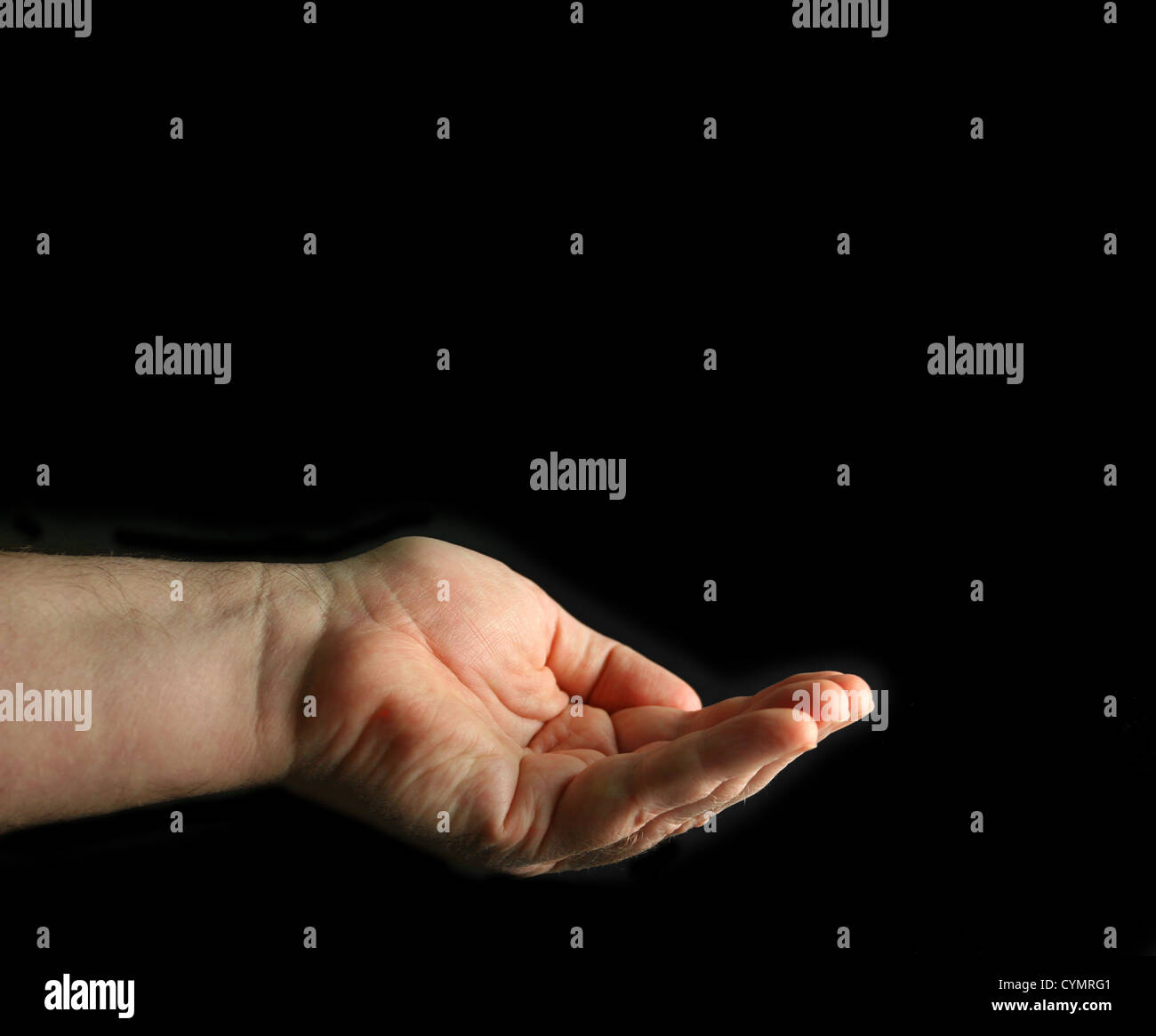 Cupped hand isolated on black Stock Photo - Alamy