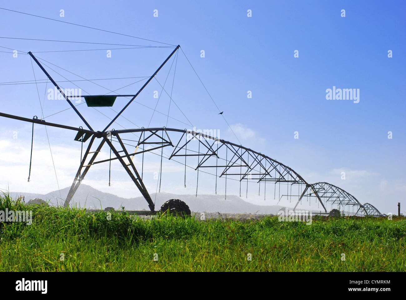 a modern irrigation system working on a field on a farm Stock Photo - Alamy