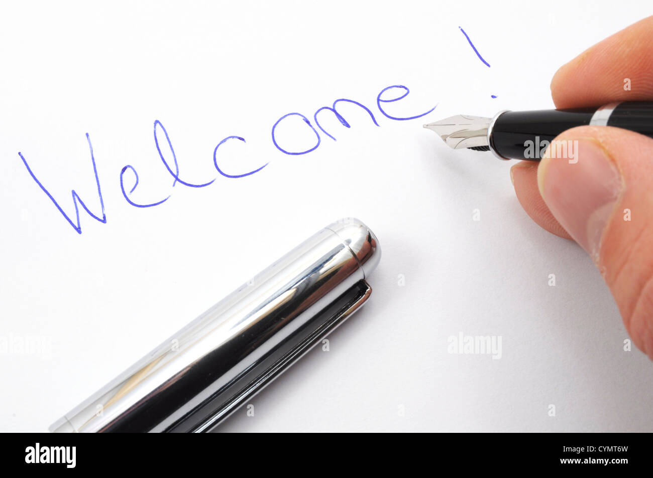 welcome message on sheet of paper with pen Stock Photo - Alamy