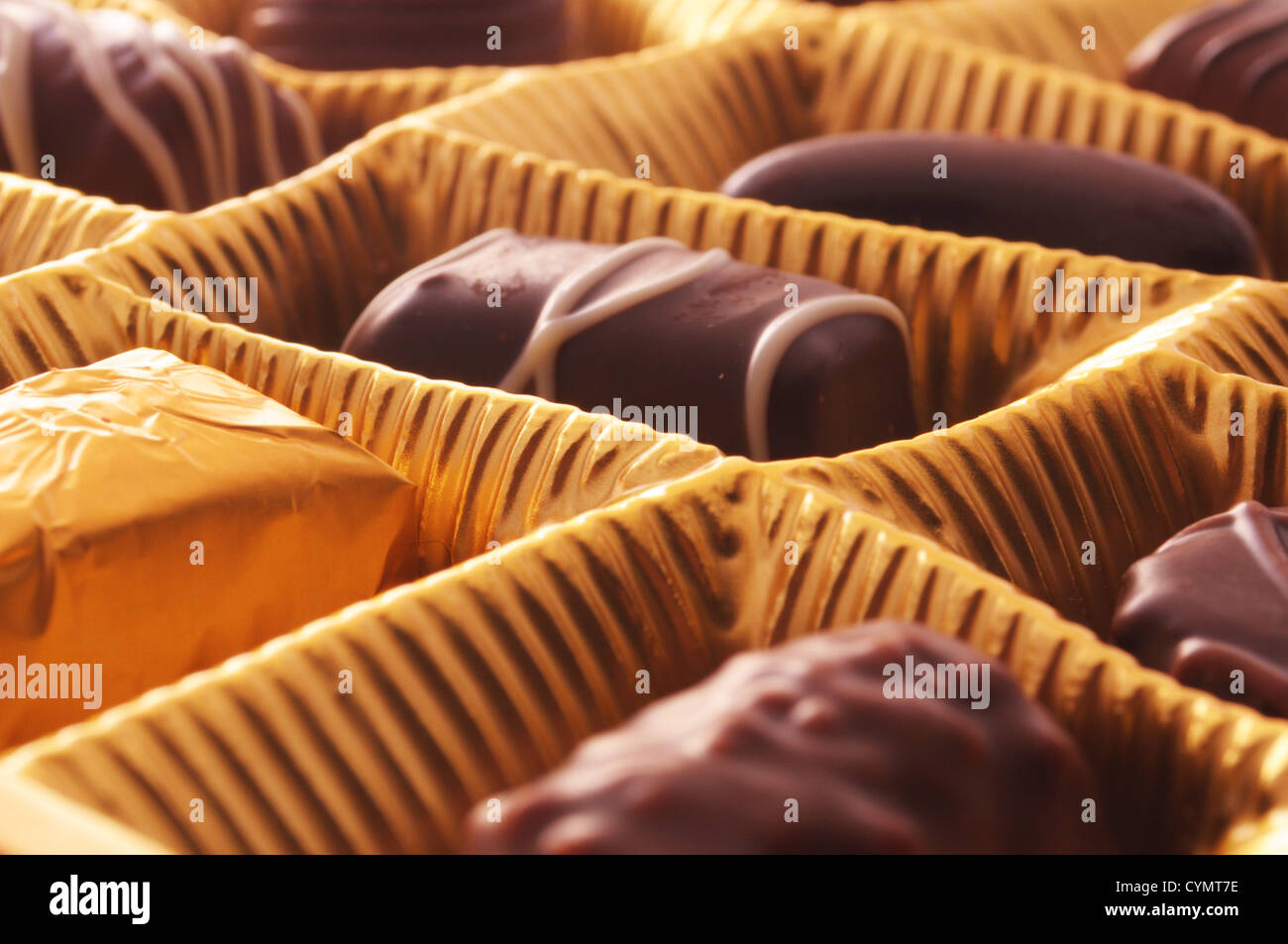 chocolate praline in golden present box for valentines day Stock Photo ...