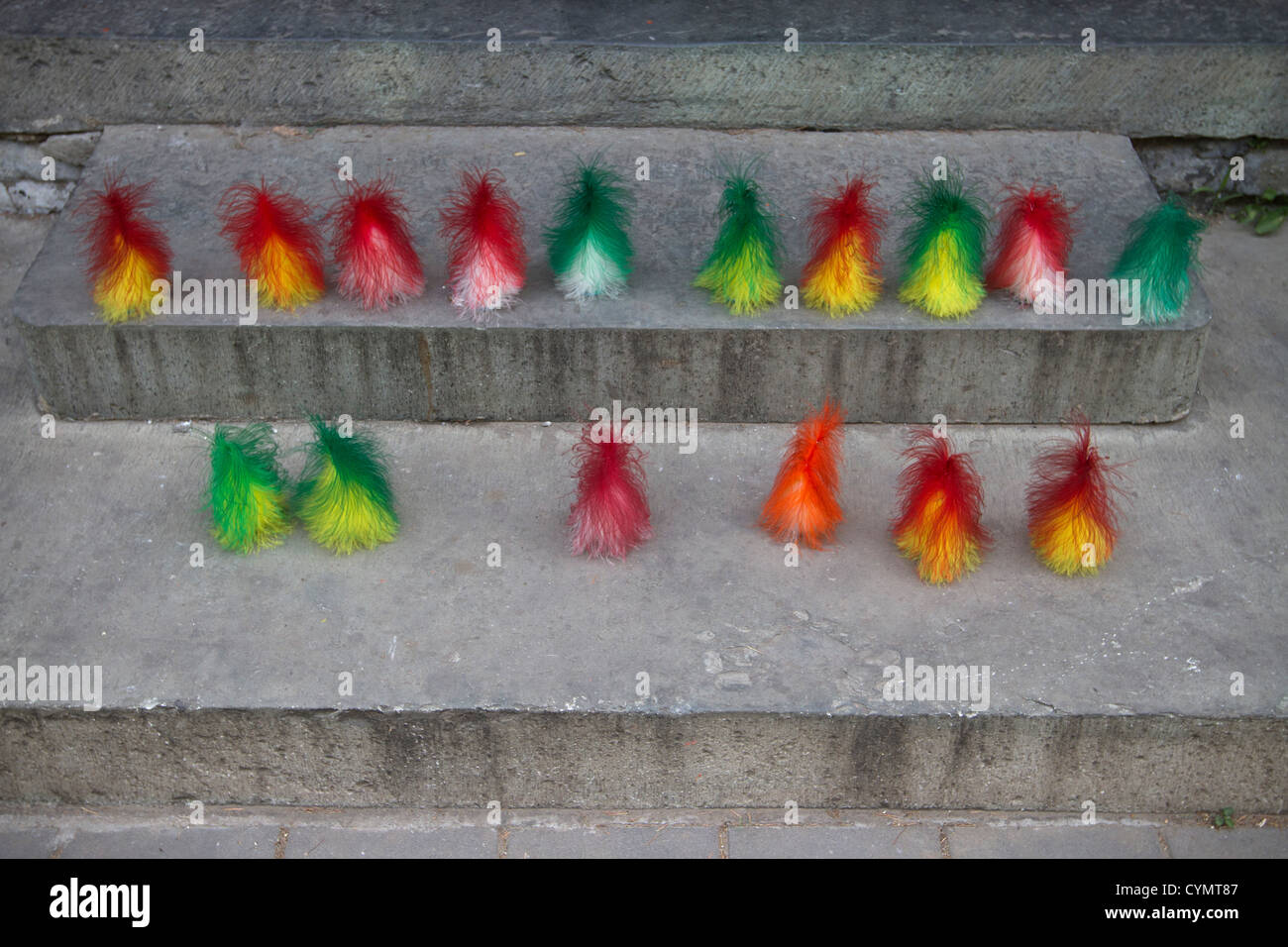A row of coloured jianzi shuttlecocks on display during morning ...