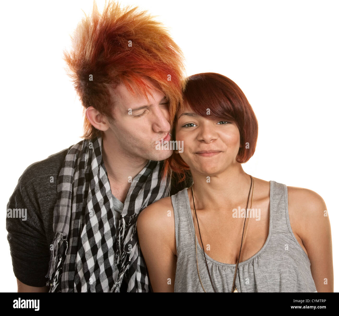 Young man with mohawk kisses mixed girlfriend over white Stock Photo ...