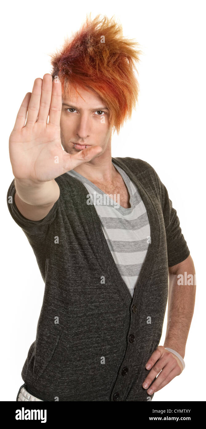Teenage male in orange mohawk with hand in front Stock Photo - Alamy