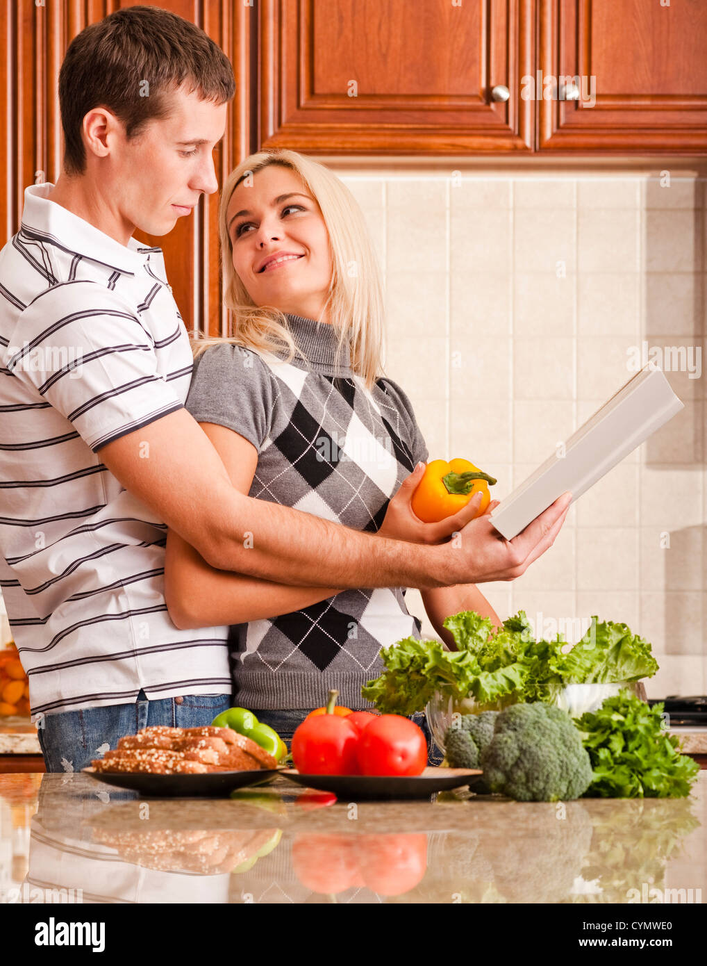 Young man hugging book hi-res stock photography and images - Alamy