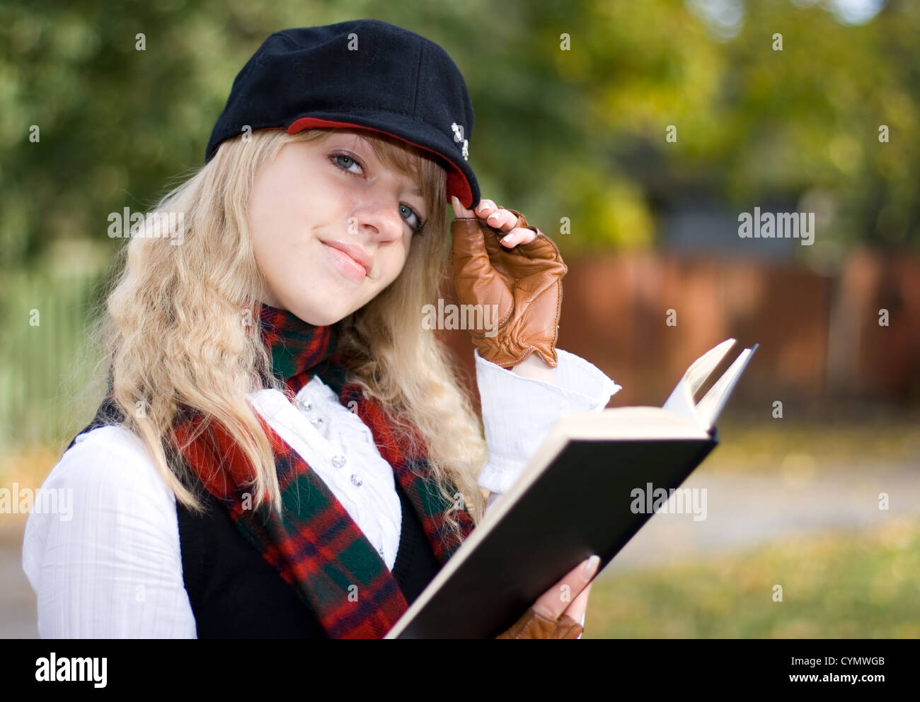 Student girl studying outside in the autumn Stock Photo - Alamy