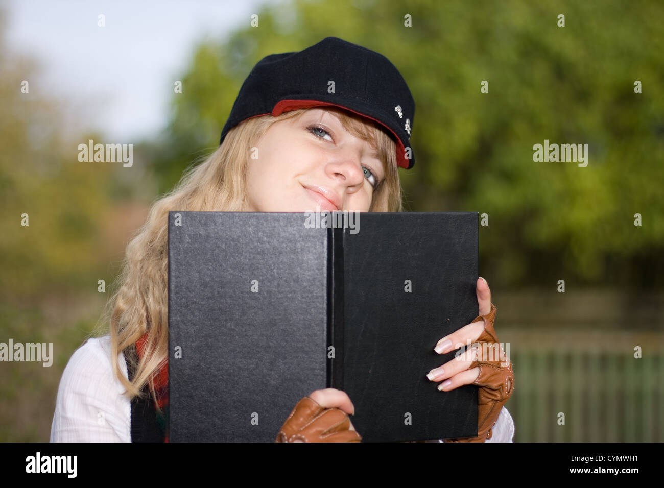 Student girl studying outside in the autumn Stock Photo - Alamy