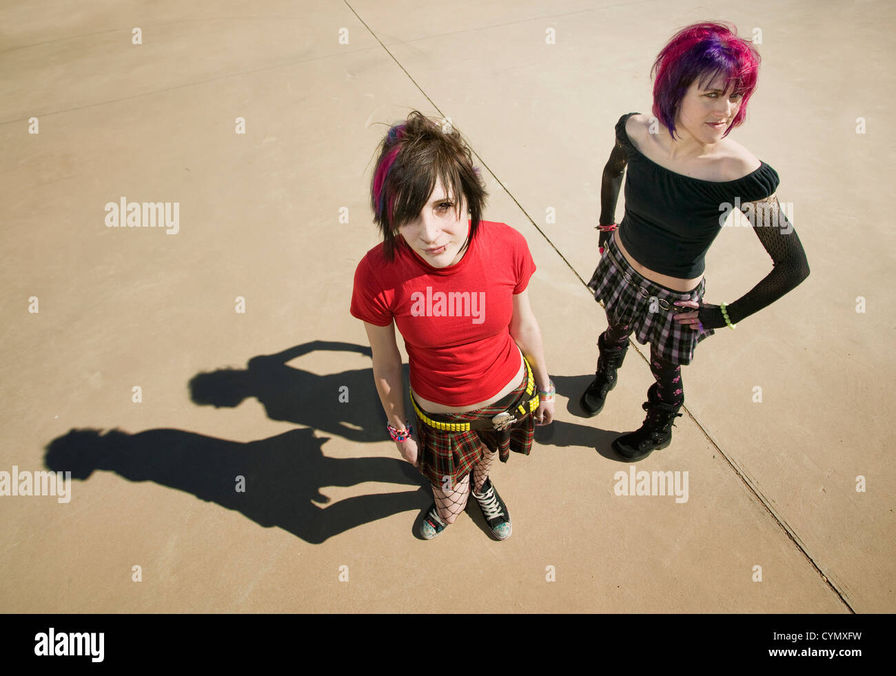 Two Punk Girls Standing on a Concrete Slab Stock Photo - Alamy