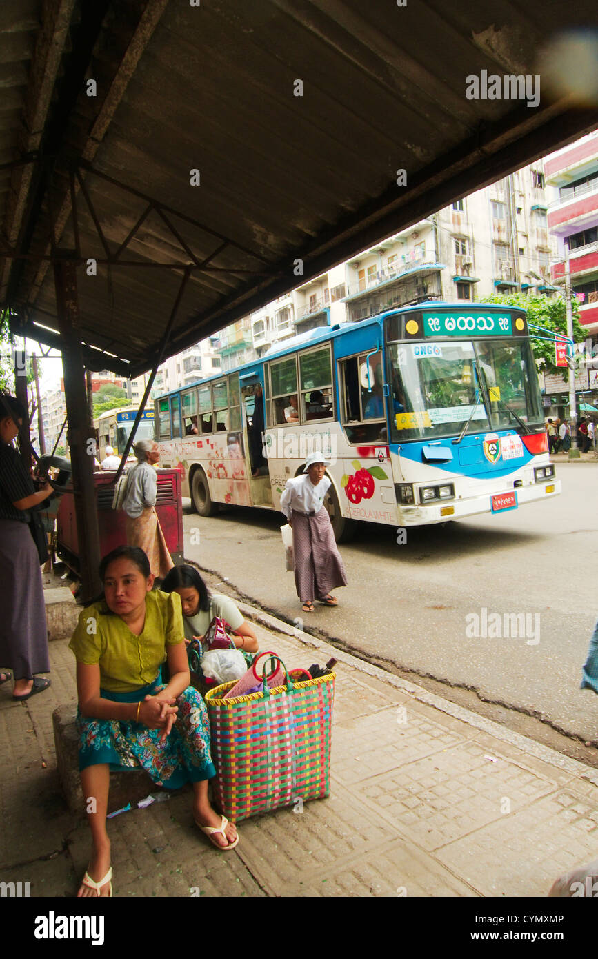 Bus stop at one of Yangon's busy avenues Stock Photo - Alamy