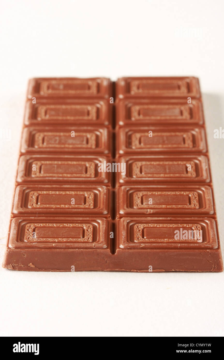 Milk chocolate bar isolated on white, shot in studio Stock Photo - Alamy