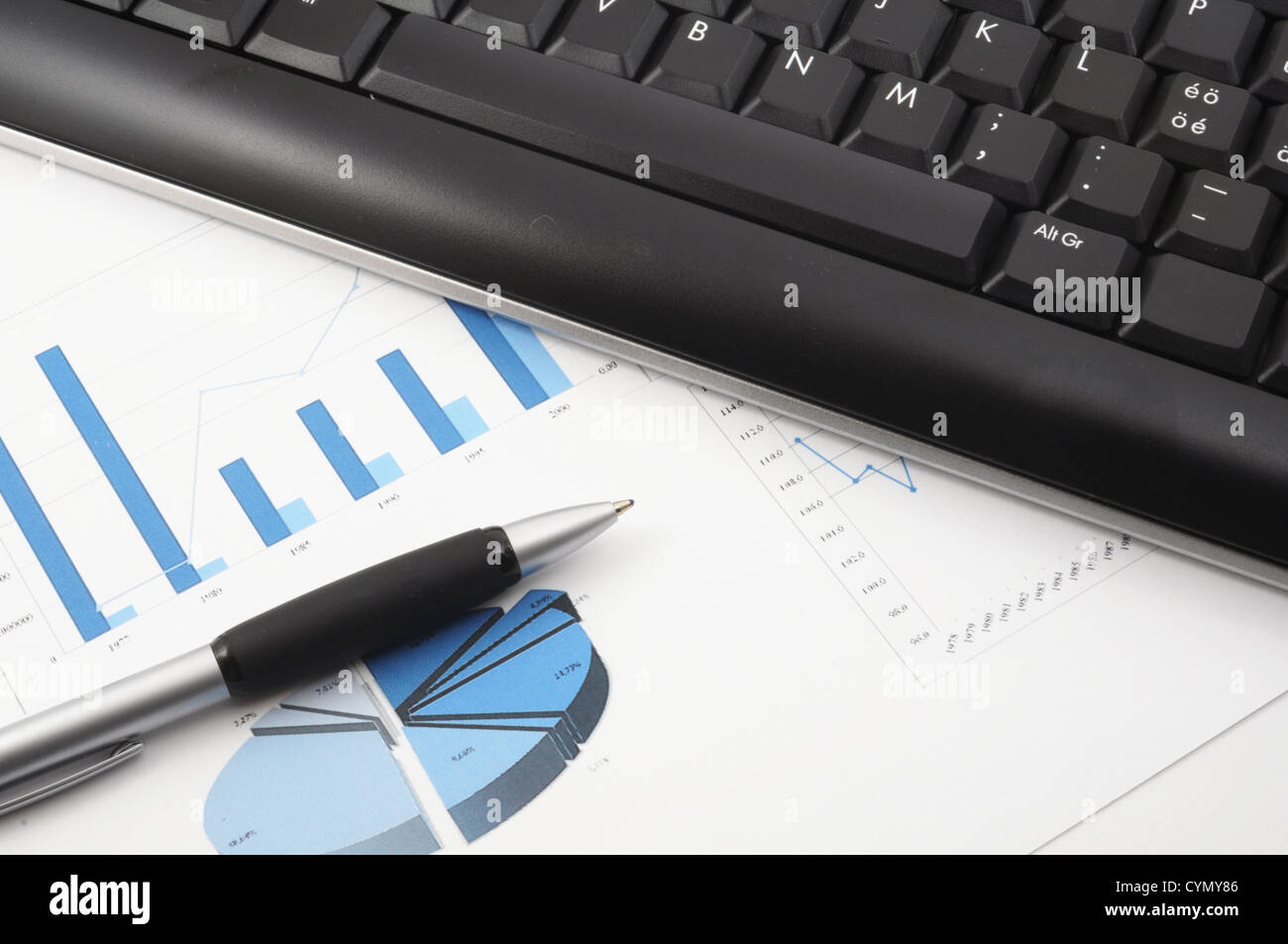 paperwork in office and computer keyboard showing success Stock Photo ...