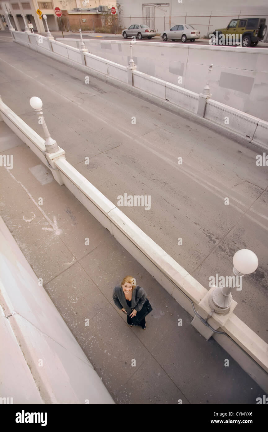 Wide shot from above of woman on a sidewalk Stock Photo - Alamy