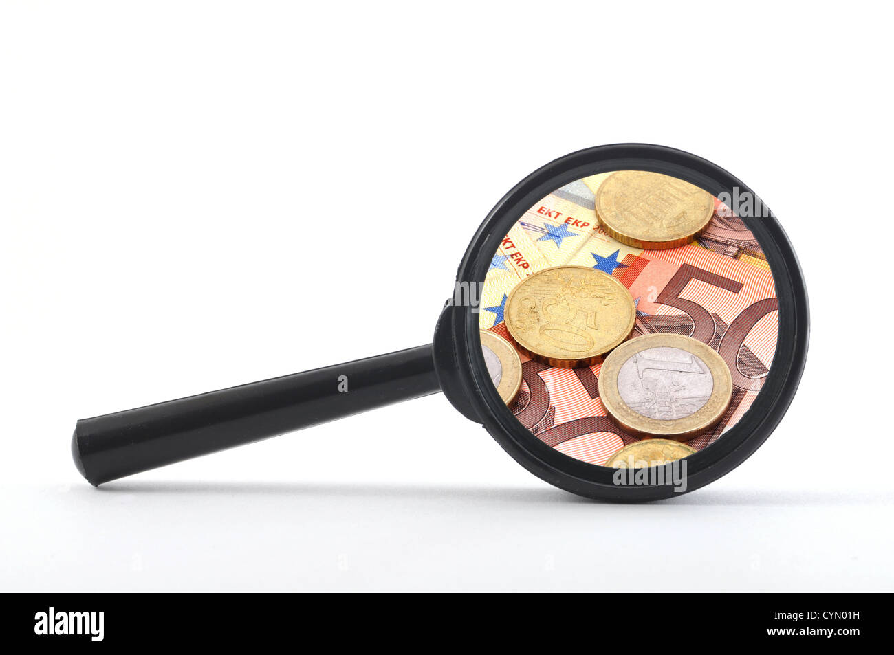 Magnifying glass coins background Cut Out Stock Images & Pictures - Alamy