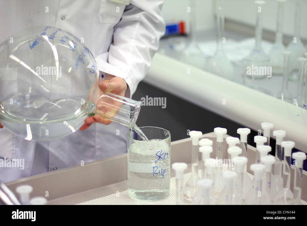 scientist working with chemicals and equipment in a real life ...