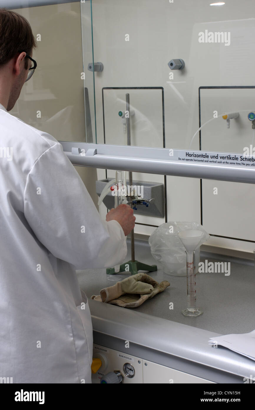 scientist working with chemicals and equipment in a real life ...