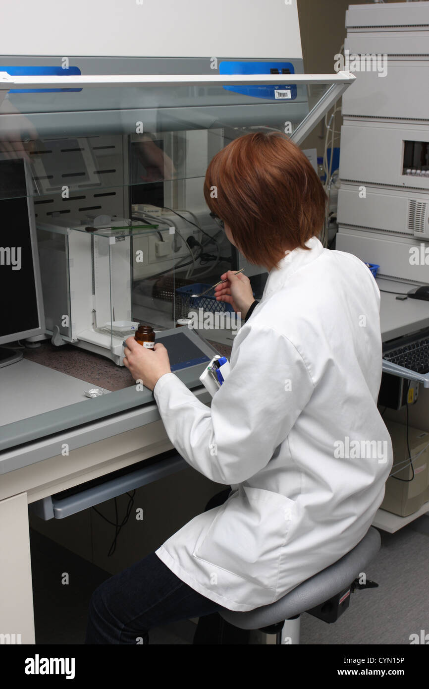 scientist working with chemicals and equipment in a real life ...