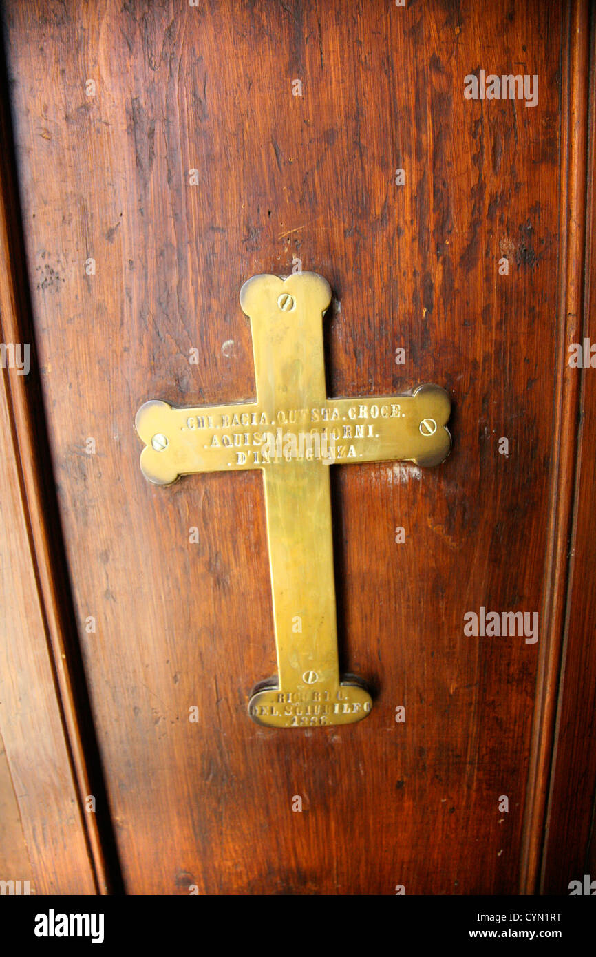 golden write cross on an old wood door Stock Photo - Alamy
