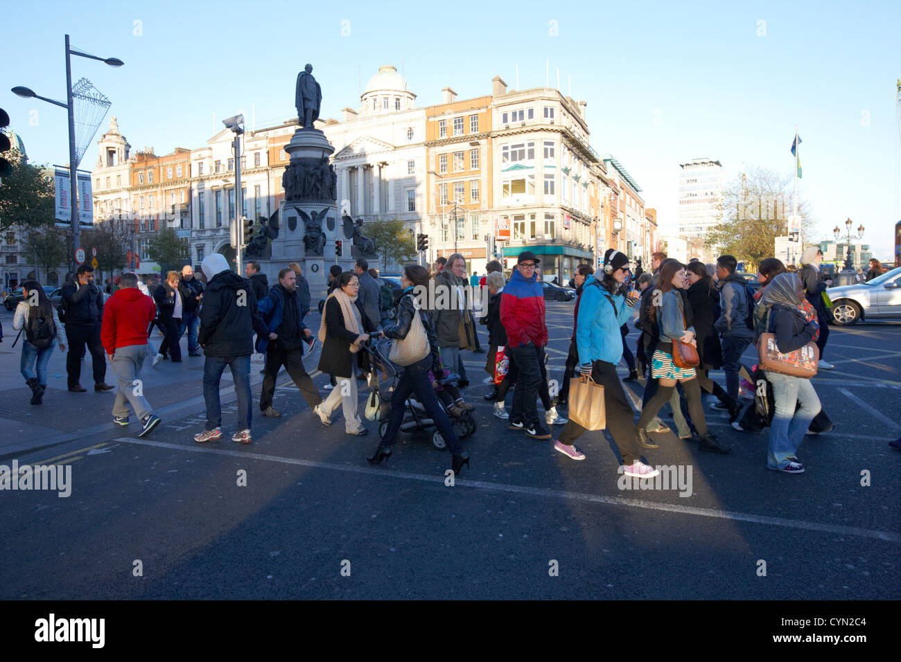 crowd of people crossing road at pedestrian crossing oconnell street ...