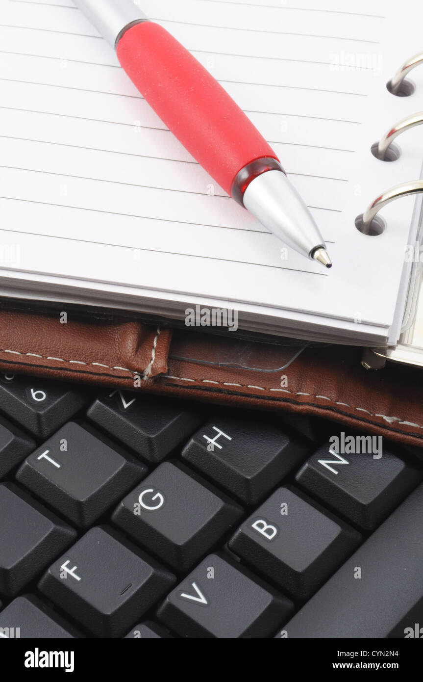 computer keyboard and organizer with pan in business office Stock Photo ...