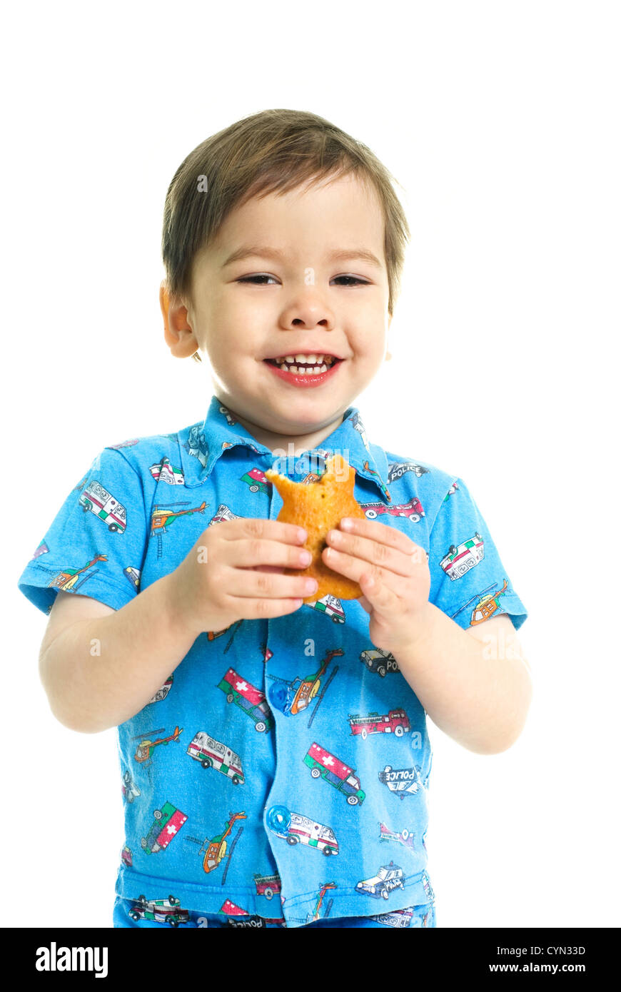 happy boy eating a cookie Stock Photo - Alamy