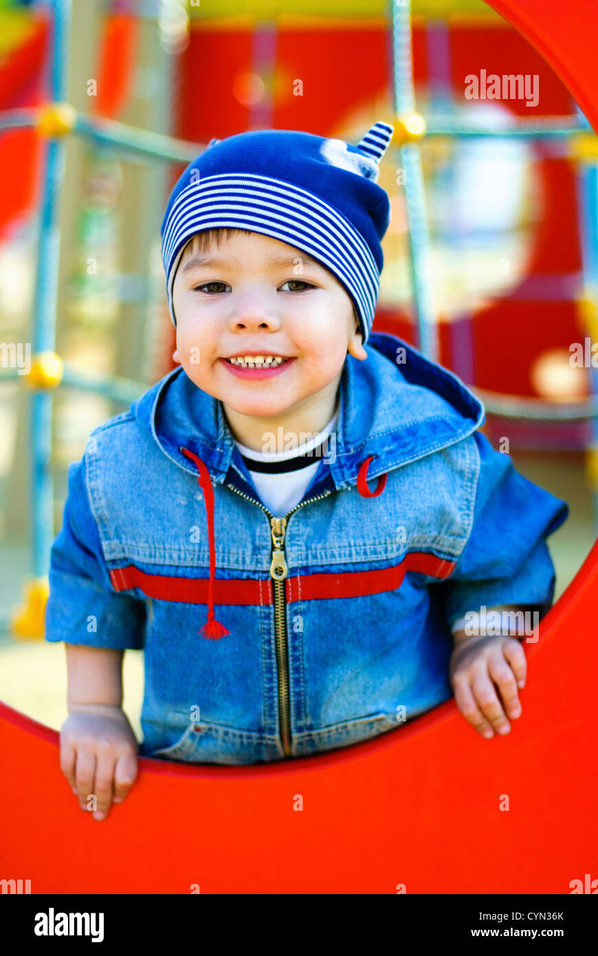 cute three year old boy playing outdoor at the Children's playground ...