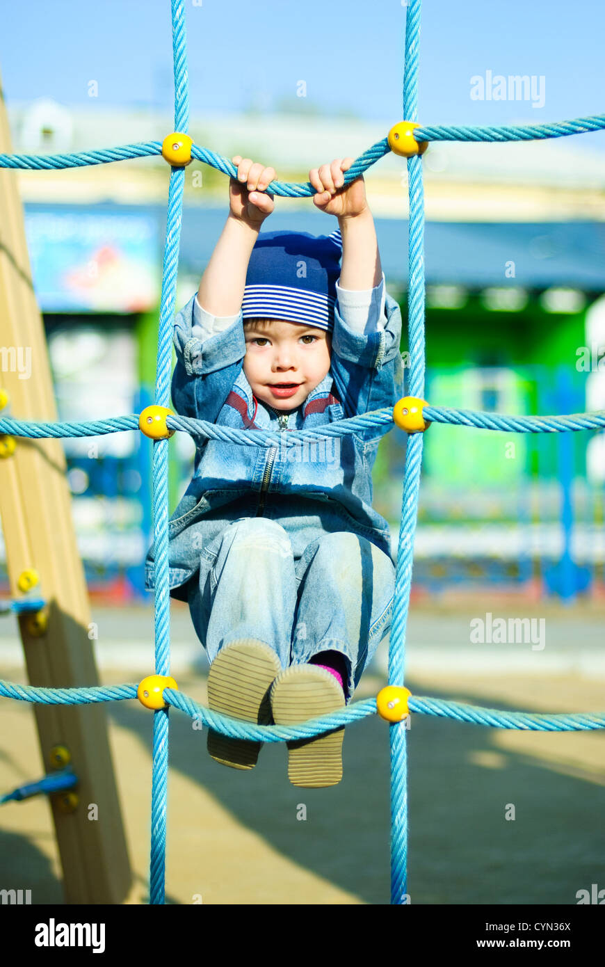 cute three year old boy playing outdoor at the Children's playground ...