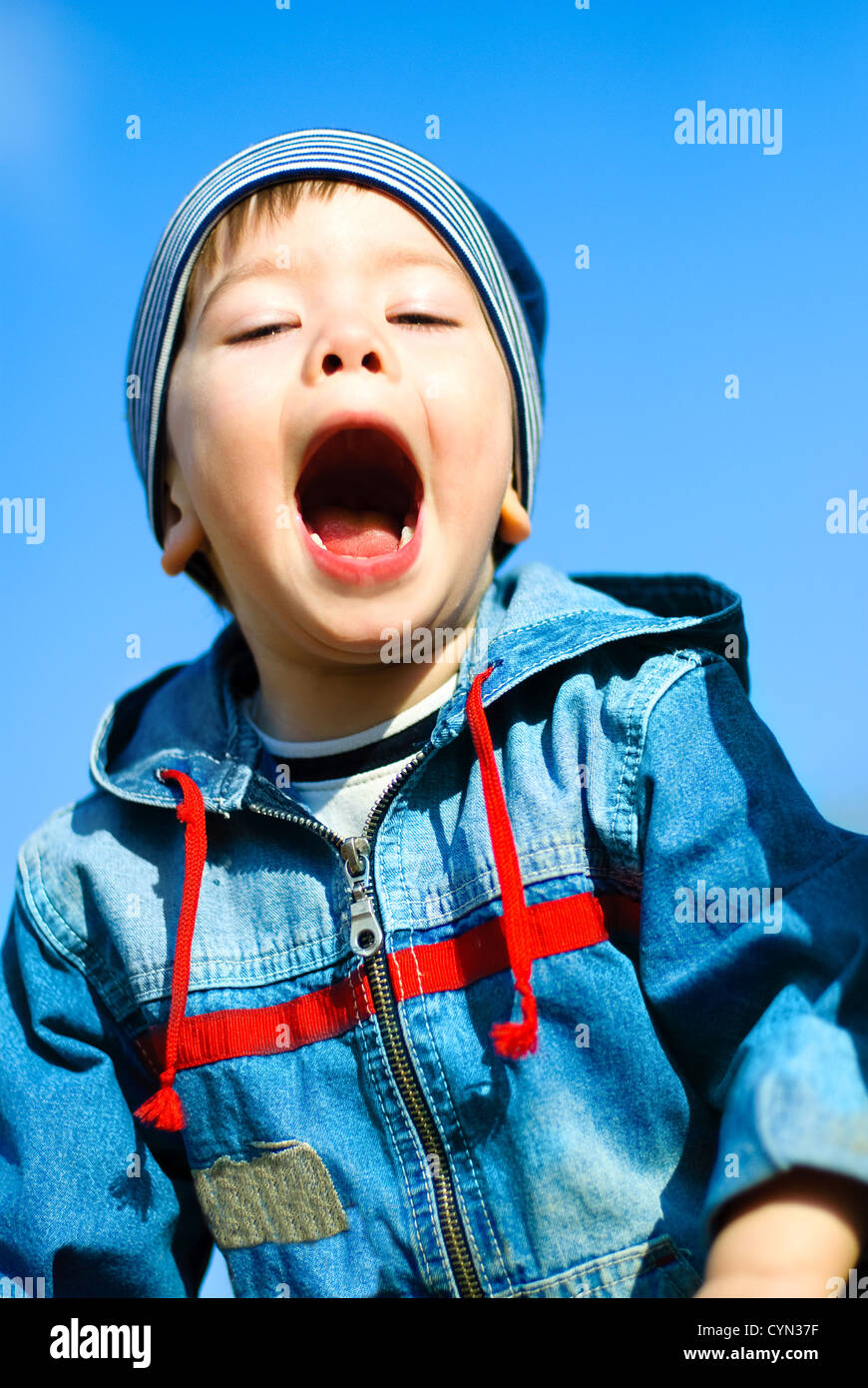 displeased screaming three year old boy playing outdoor Stock Photo - Alamy
