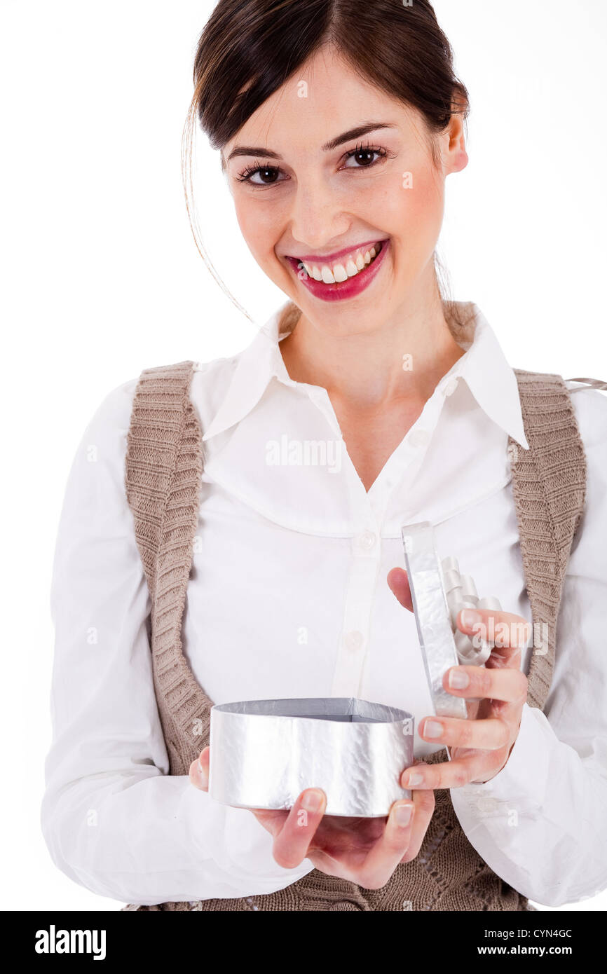 Women smiling and happily opening her gift on a white isolated ...