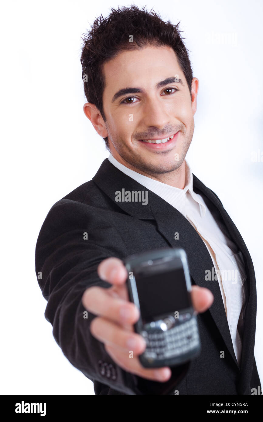 Young business man showing mobile phone,indoor studio Stock Photo - Alamy