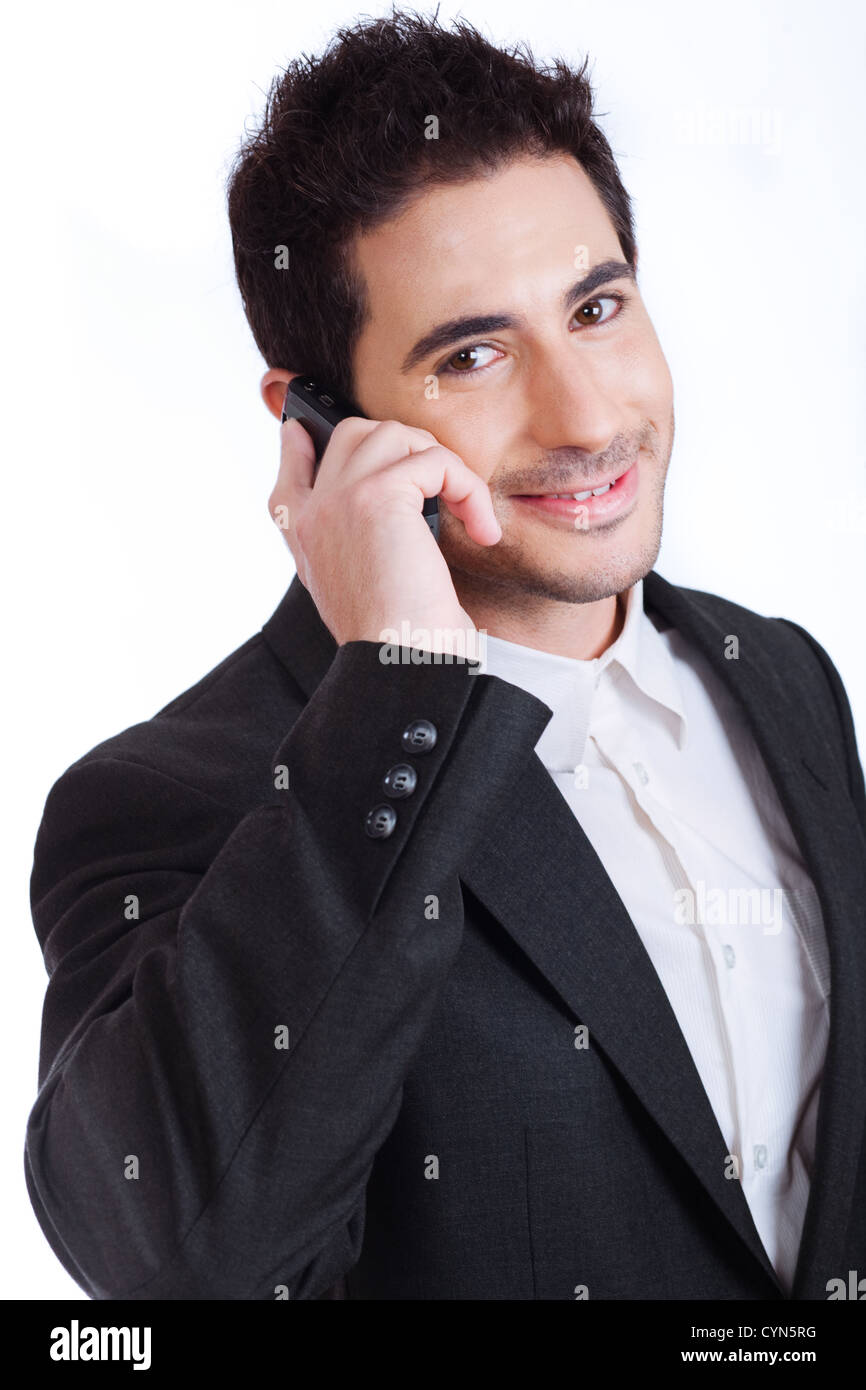 Handsome Young business man on a phone call,indoor studio Stock Photo ...