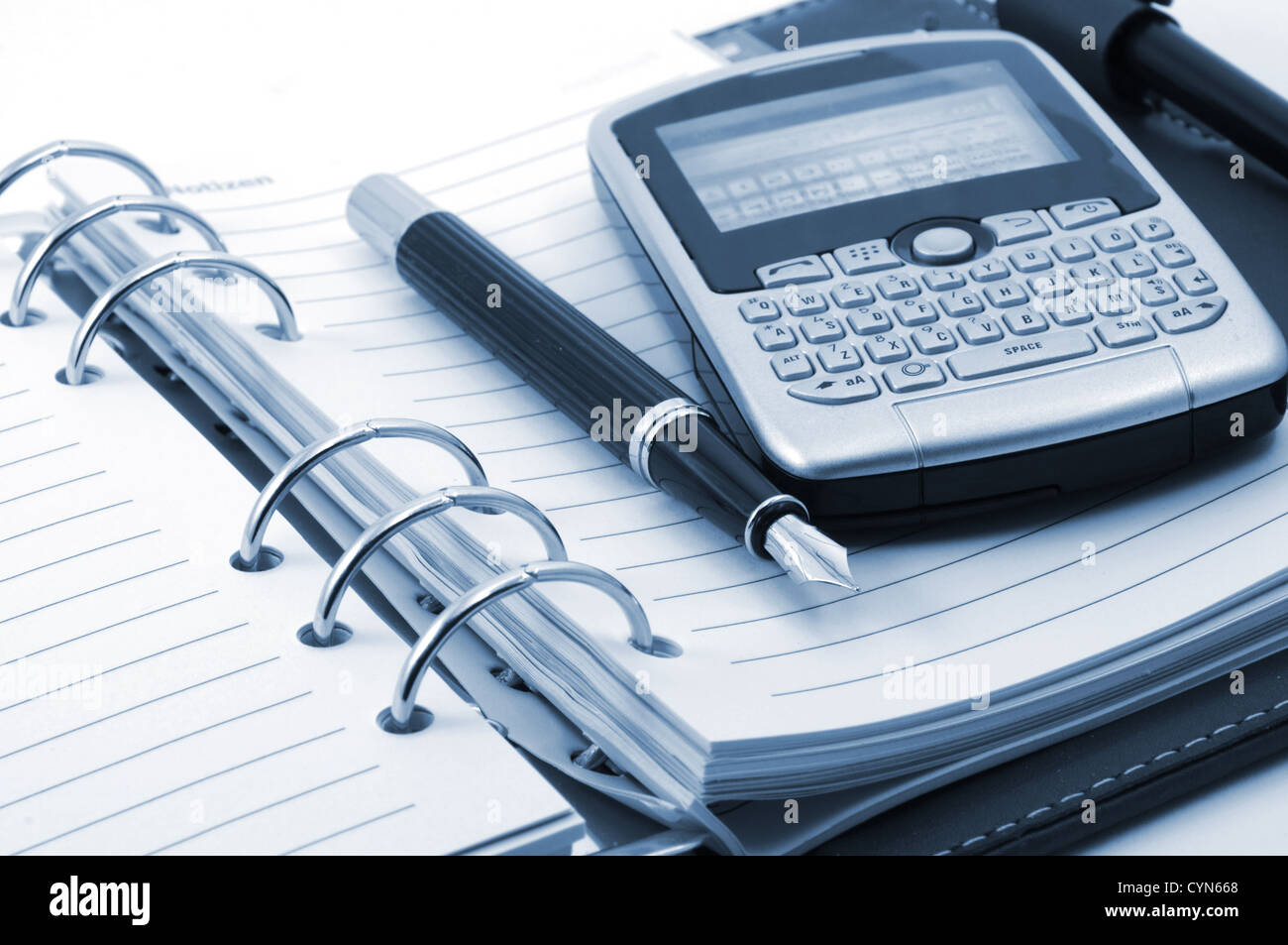 organizer and cell phone or pda showing business concept Stock Photo ...