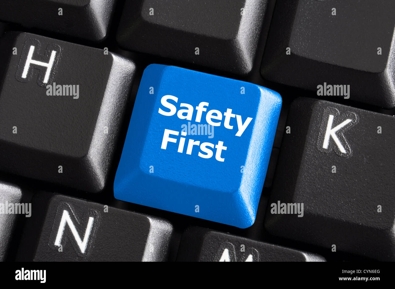 safety first concept with blue key on computer keyboard Stock Photo - Alamy