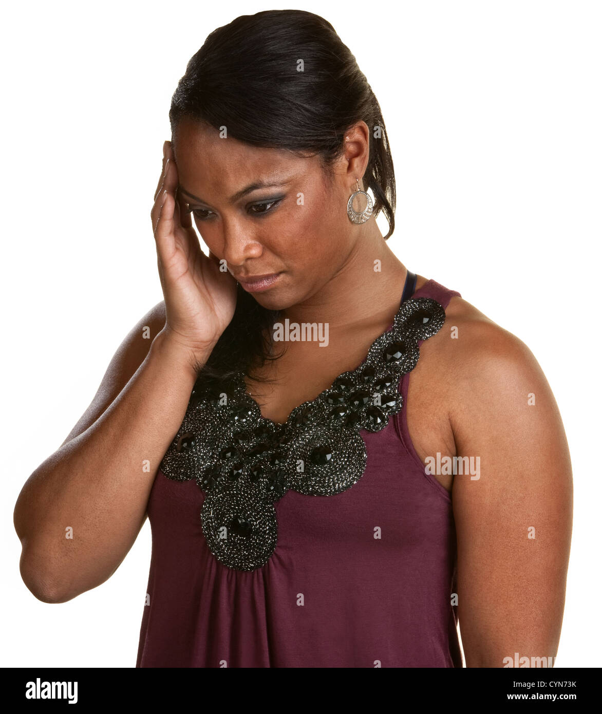 Black woman with hand on head looking down Stock Photo - Alamy