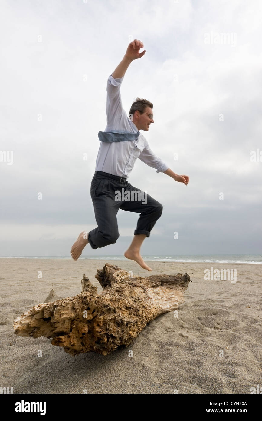 Businessman overcoming an obstacle Stock Photo - Alamy