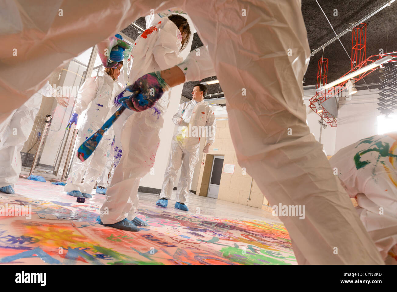People having fun during art therapy session drawing paint Stock Photo ...
