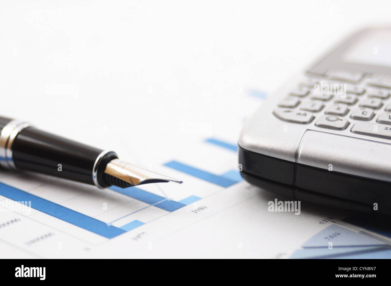 paperwork with diagram and pen showing success Stock Photo - Alamy