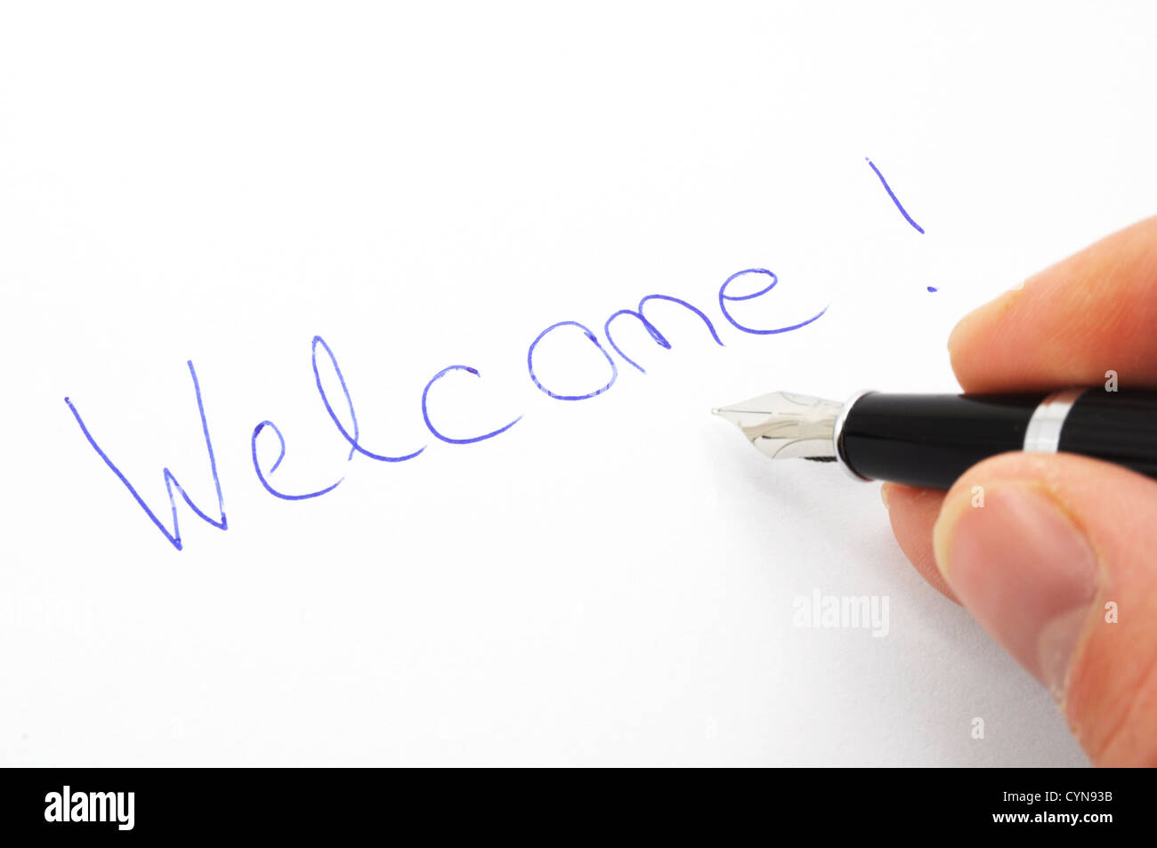 welcome message on sheet of paper with pen Stock Photo - Alamy