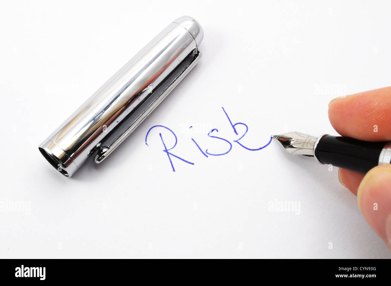 risk management concept with word on paper and pen Stock Photo - Alamy